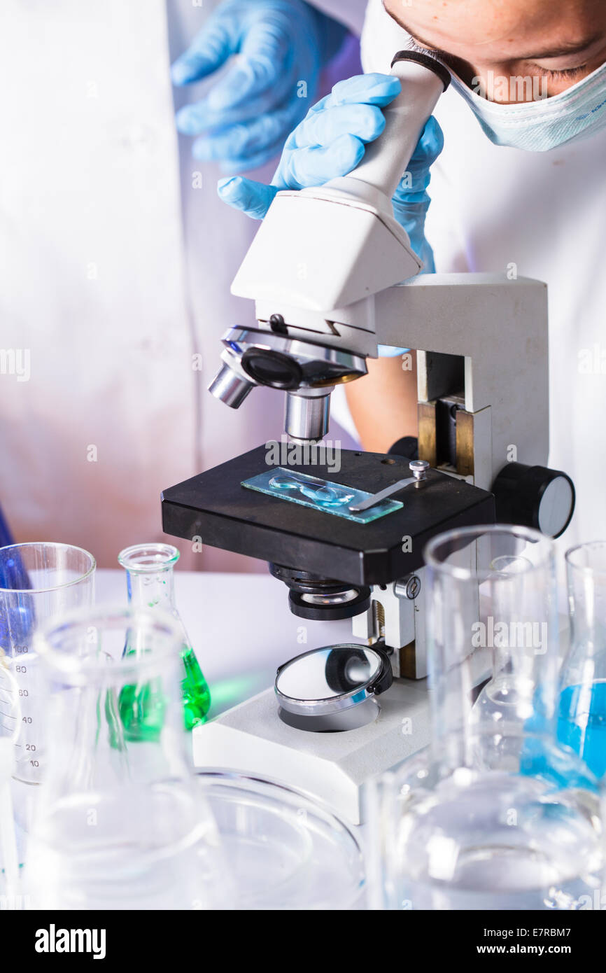 Female scientist look microscope hi-res stock photography and images ...