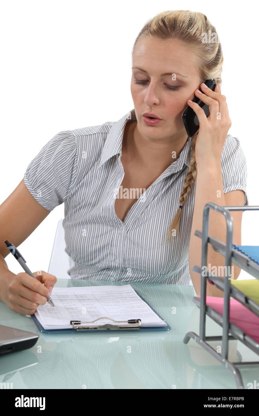 Receptionist making telephone call Stock Photo - Alamy