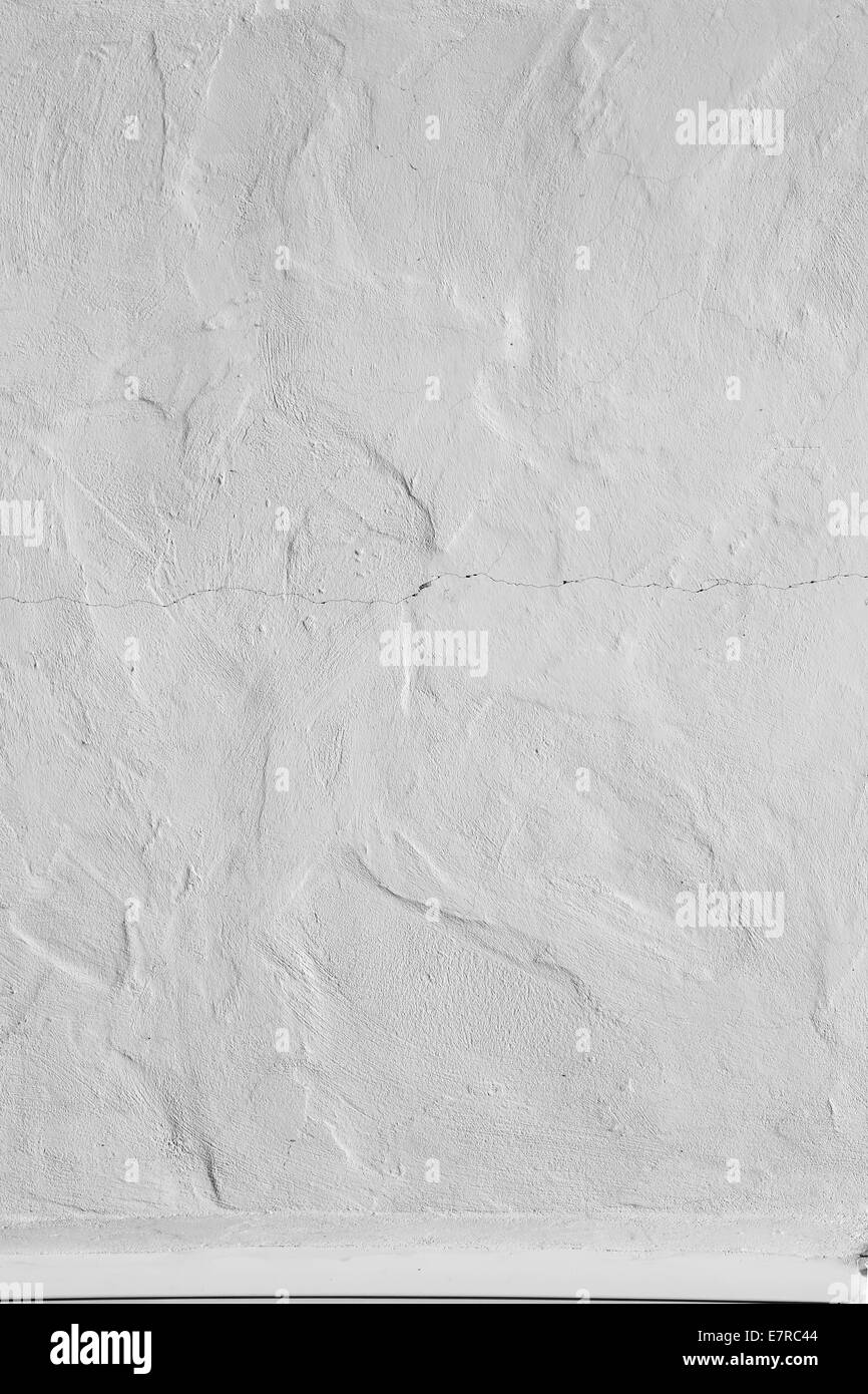 white background, lime plaster wall with scratches and irregularities ...