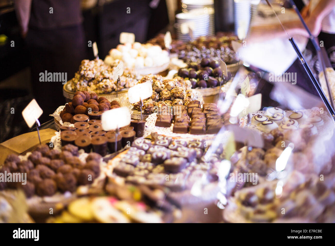 Chocolate candies on showcase in the store Stock Photo - Alamy