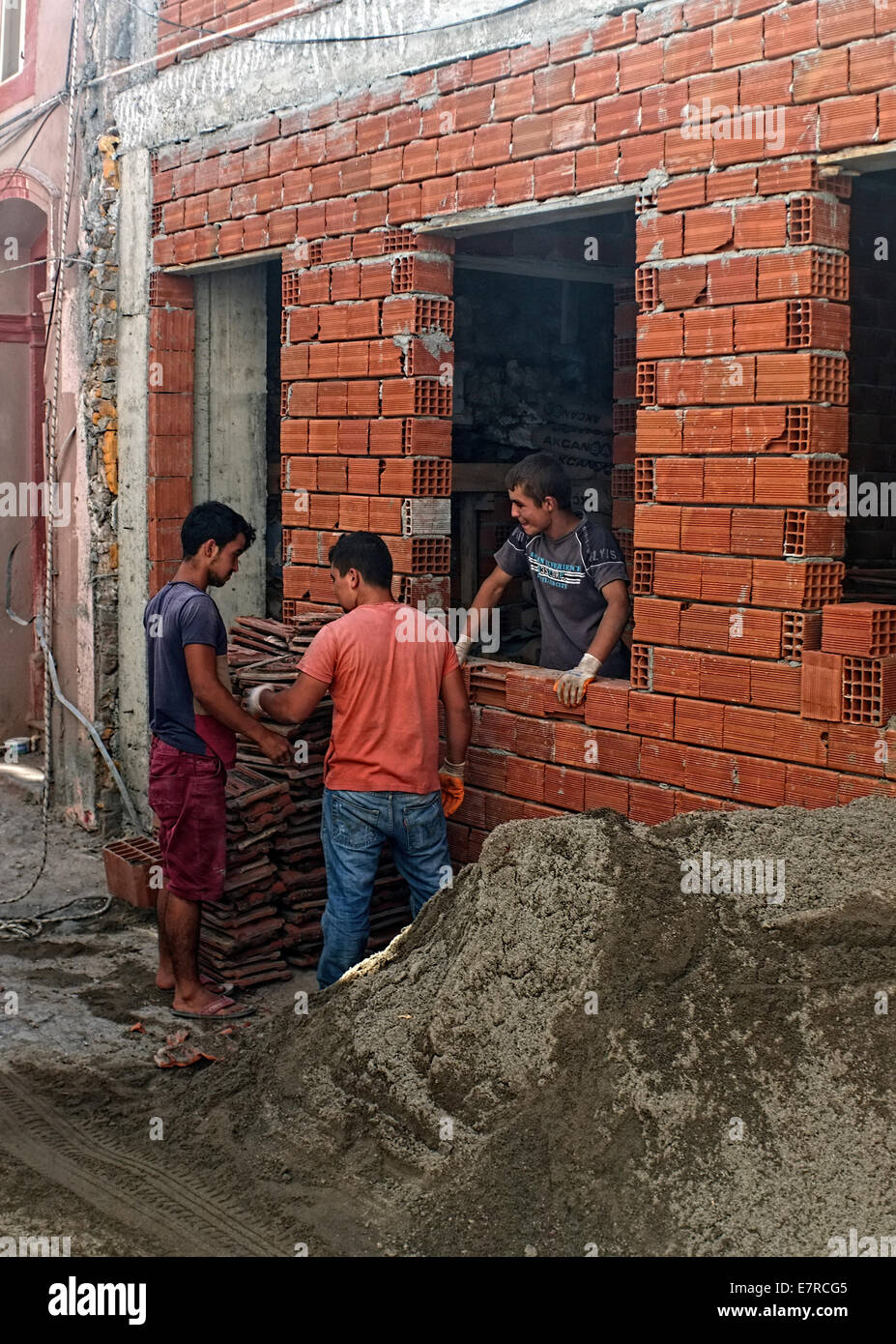 Workers working in a construction side Stock Photo - Alamy
