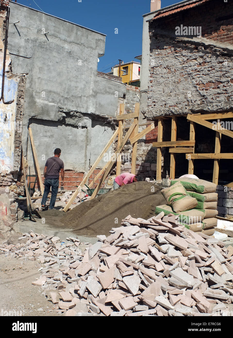 Workers working in a construction side Stock Photo - Alamy