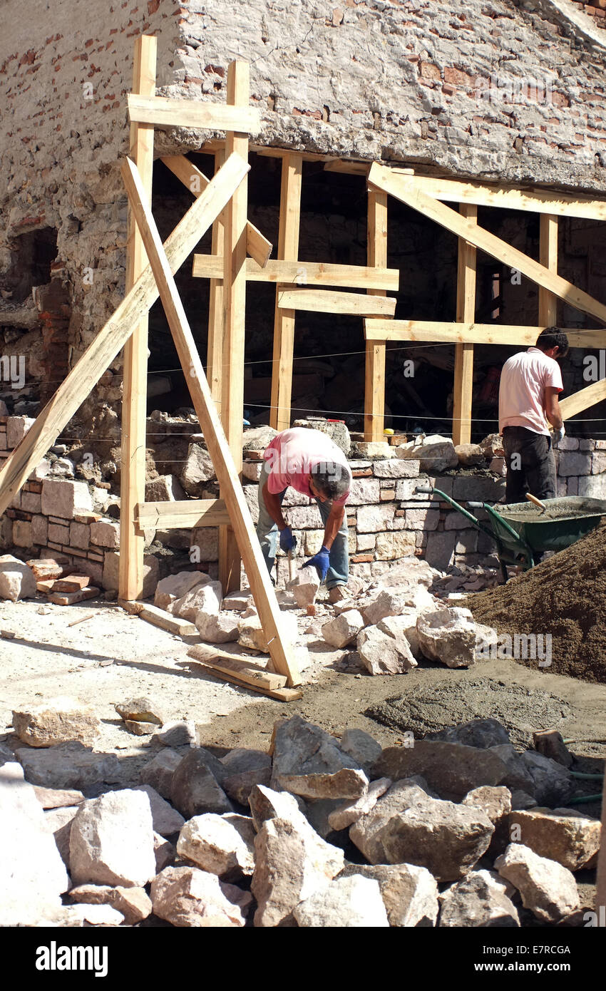 Workers working on a construction side Stock Photo - Alamy
