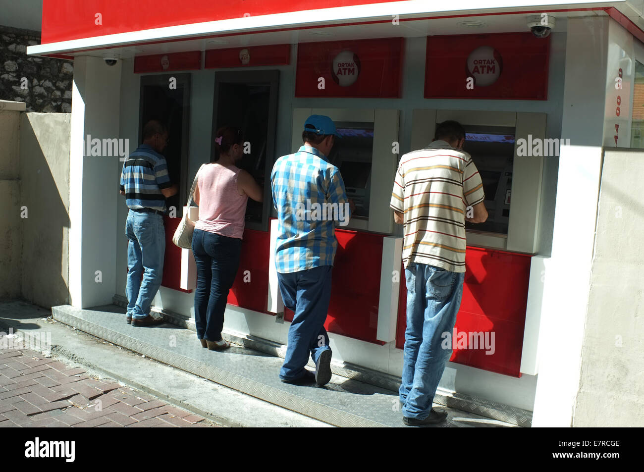 People withdrawing money from ATM machines Stock Photo - Alamy