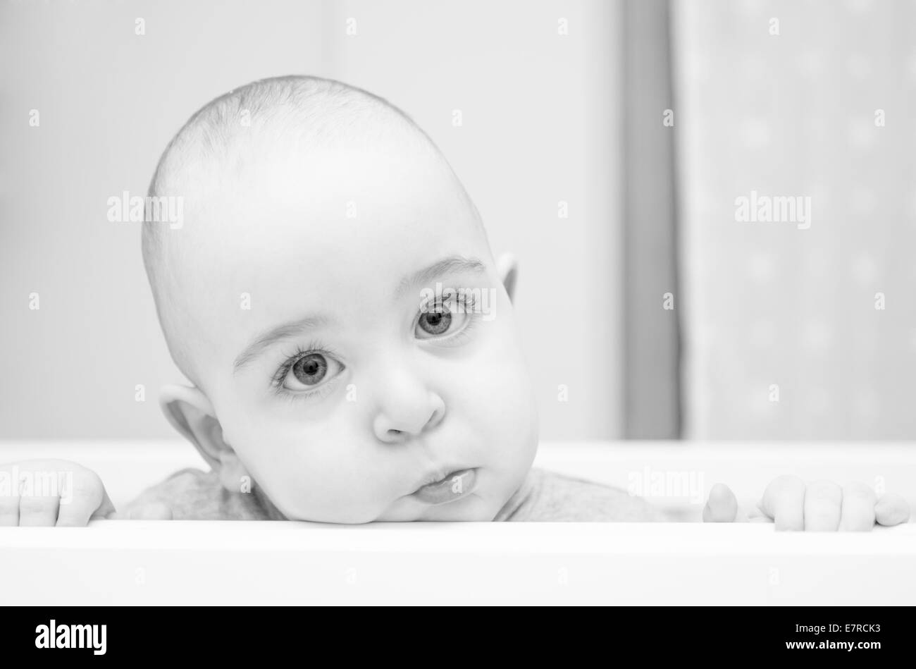 Baby boy looking curiously Stock Photo - Alamy