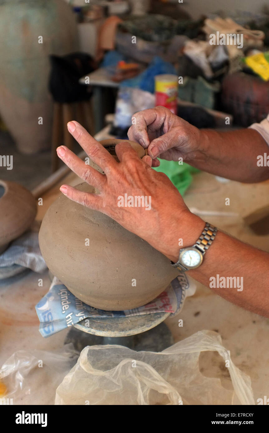 Hands working with clay Stock Photo - Alamy