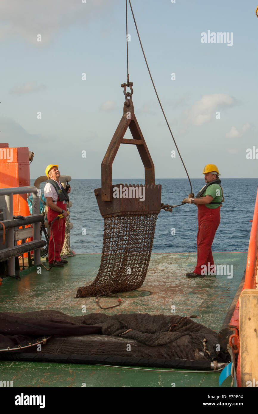 To pick up stones from deep submarine Walvis Ridge volcanoes the crew ...