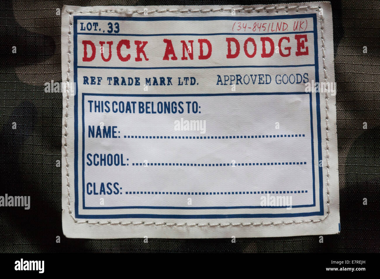 Duck and Dodge label in child's jacket to write owner's details Stock ...