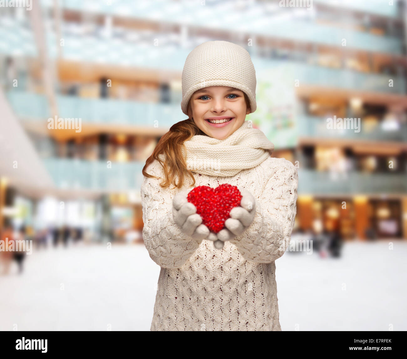 dreaming girl in winter clothes with red heart Stock Photo - Alamy