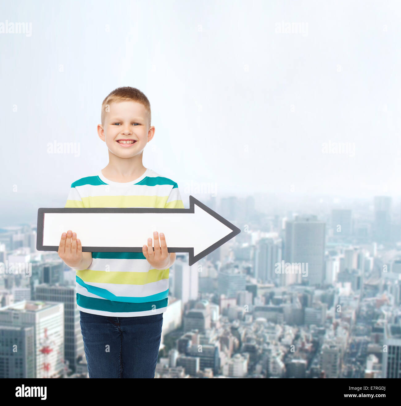 smiling little boy with blank arrow pointing right Stock Photo - Alamy