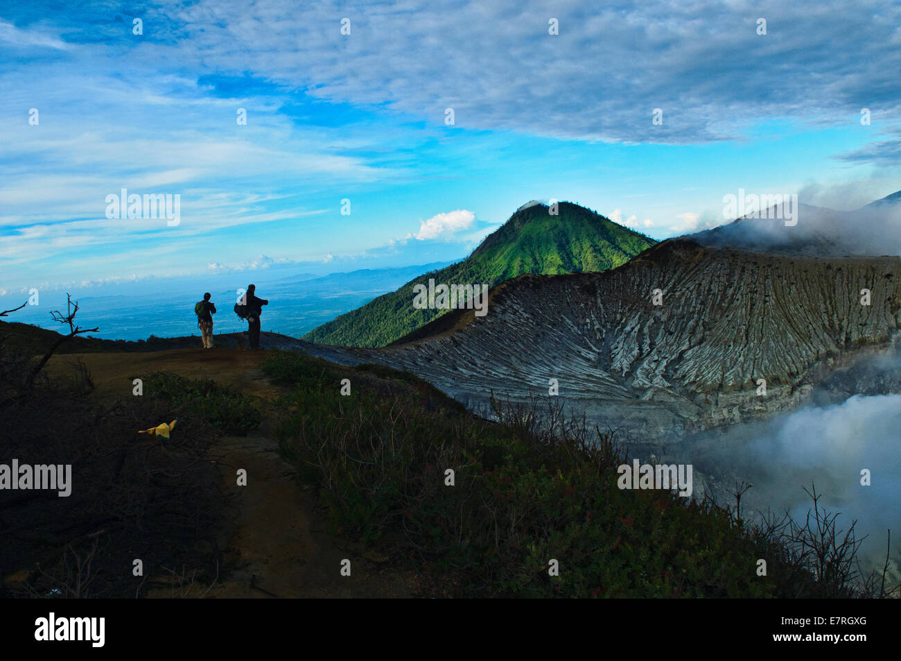 Tourists at the top of the Kawah Ijen crater in East Java, Indonesia ...