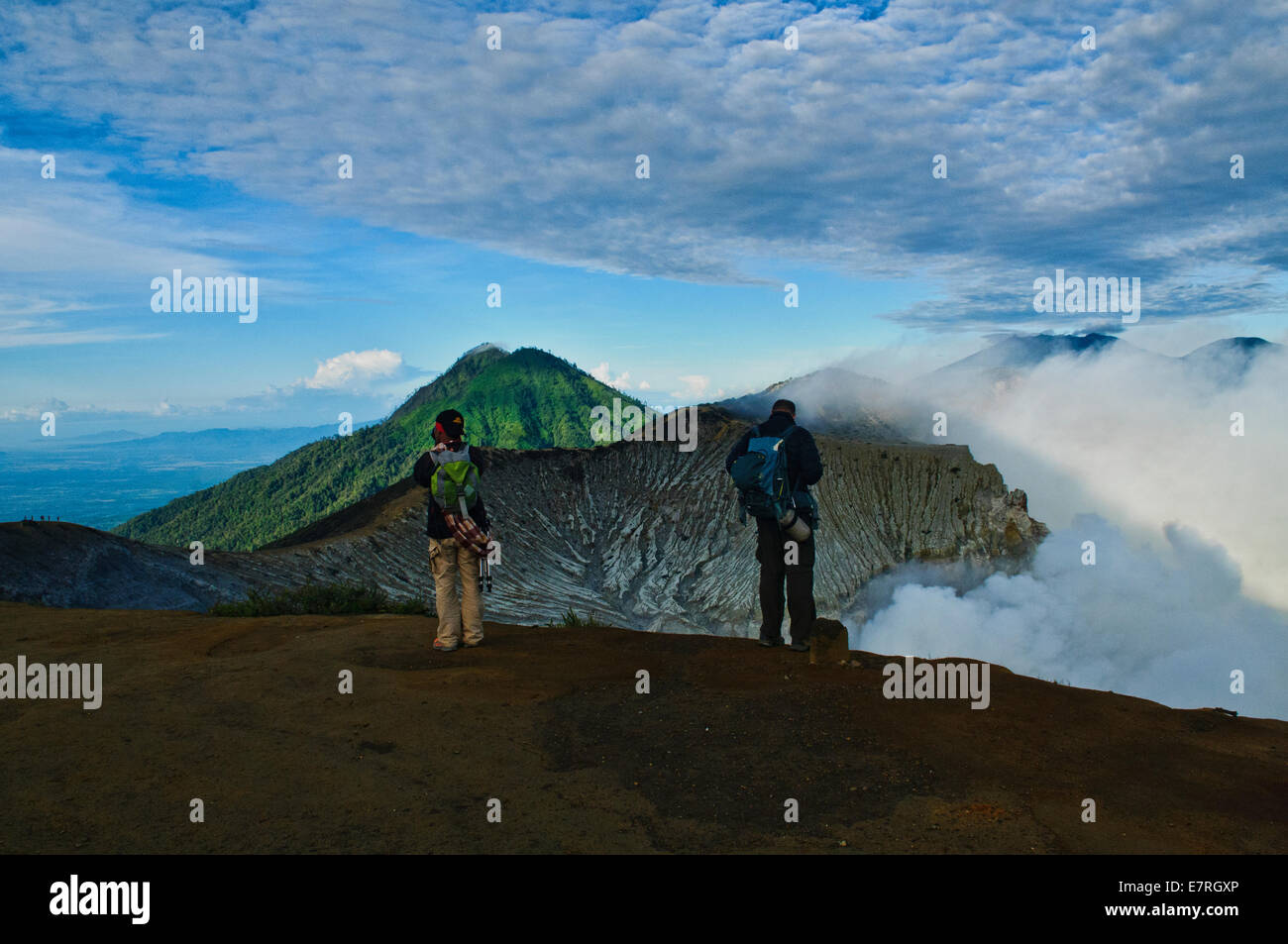 Tourists at the top of the Kawah Ijen crater in East Java, Indonesia ...