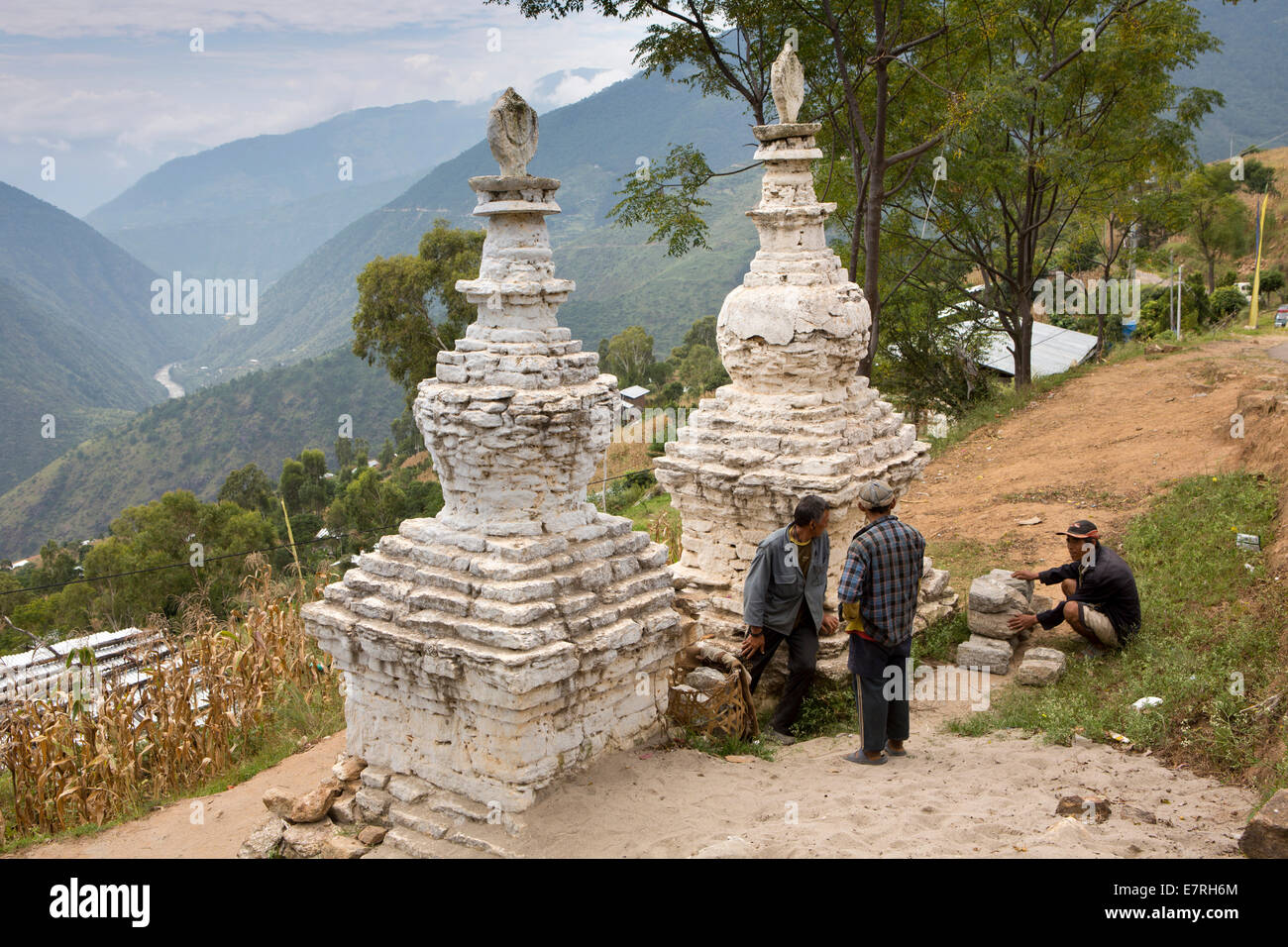 Eastern Bhutan, Trashi Yangtse, workers carrying construction stone ...