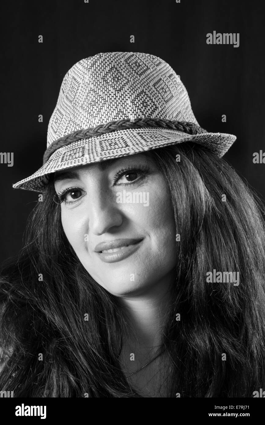 Woman wearing trendy small hat Stock Photo - Alamy