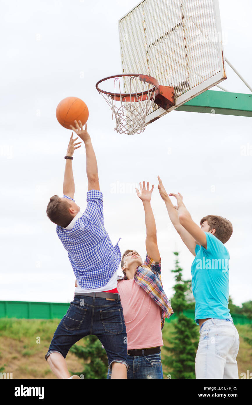 group of teenagers playing basketball Stock Photo - Alamy