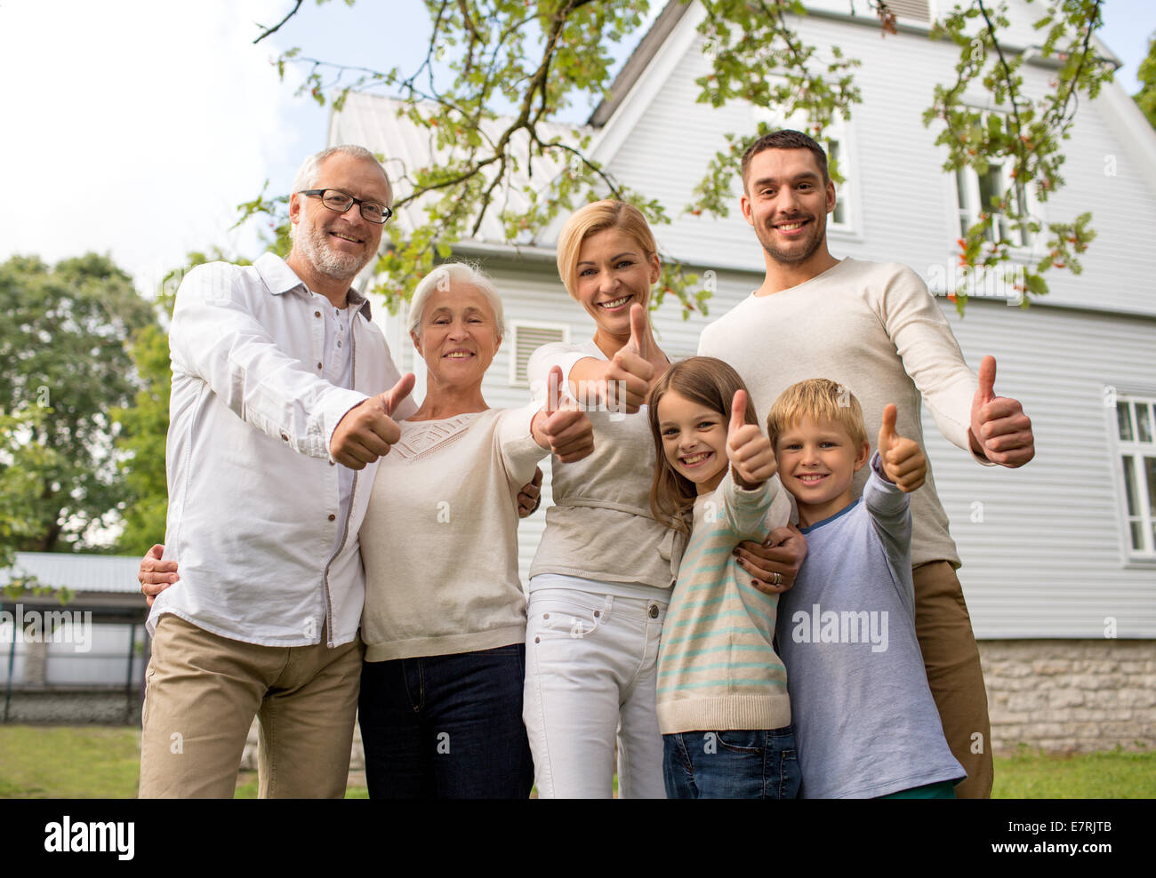 happy family in front of house outdoors Stock Photo - Alamy