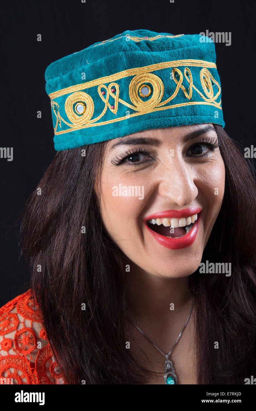 Woman wearing traditional middle eastern hat Stock Photo - Alamy