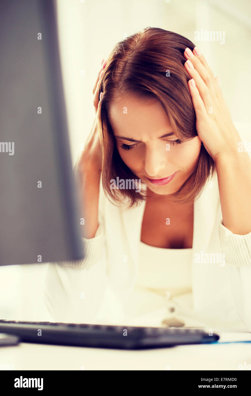 stressed woman with computer Stock Photo - Alamy