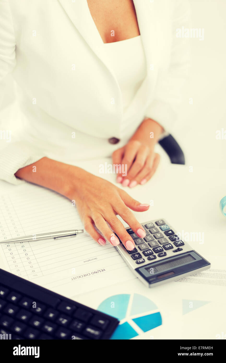 woman hand with calculator and papers Stock Photo - Alamy