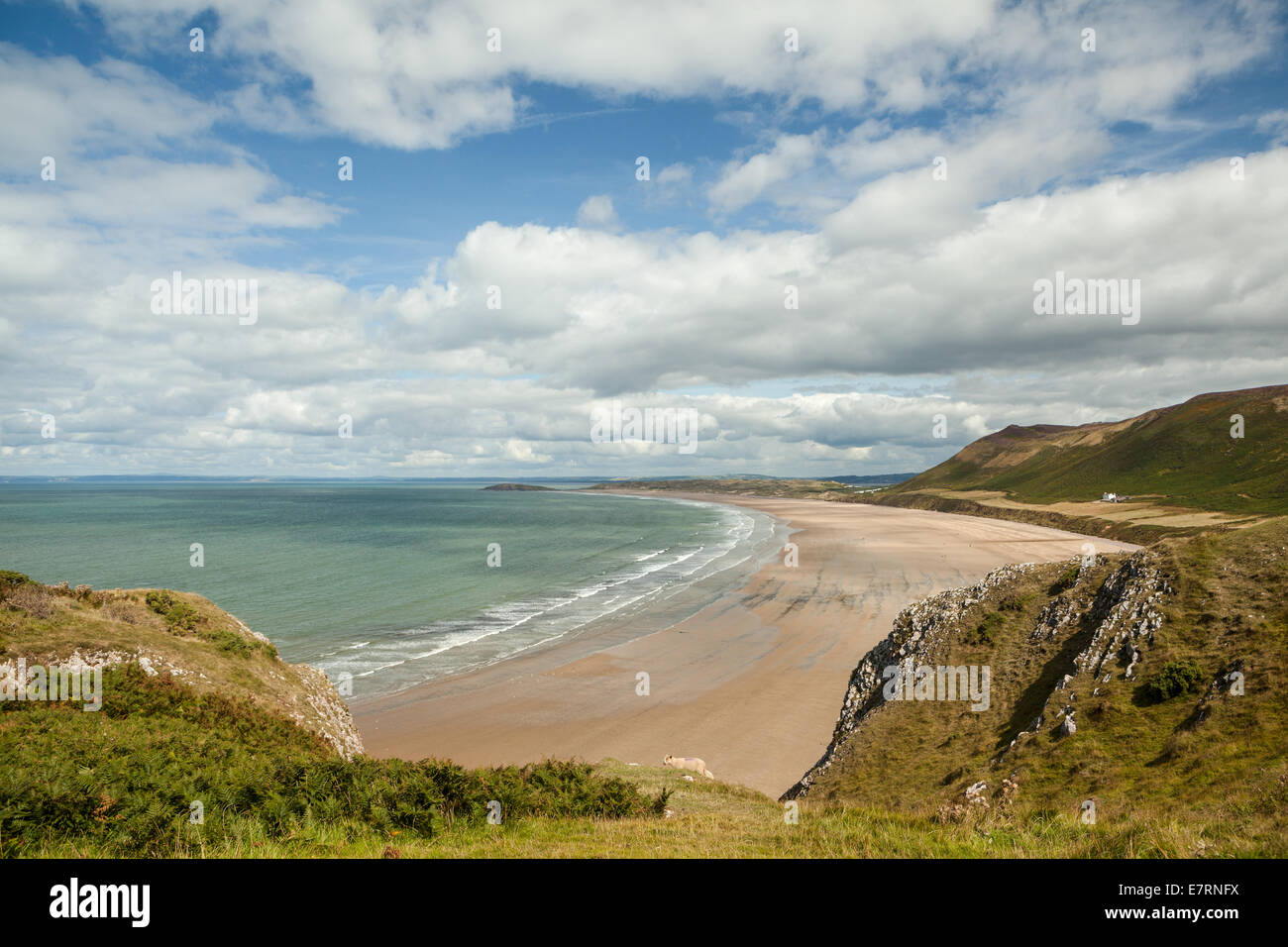 Rhossili Bay beach viewed from above in August, with blue sky and ...