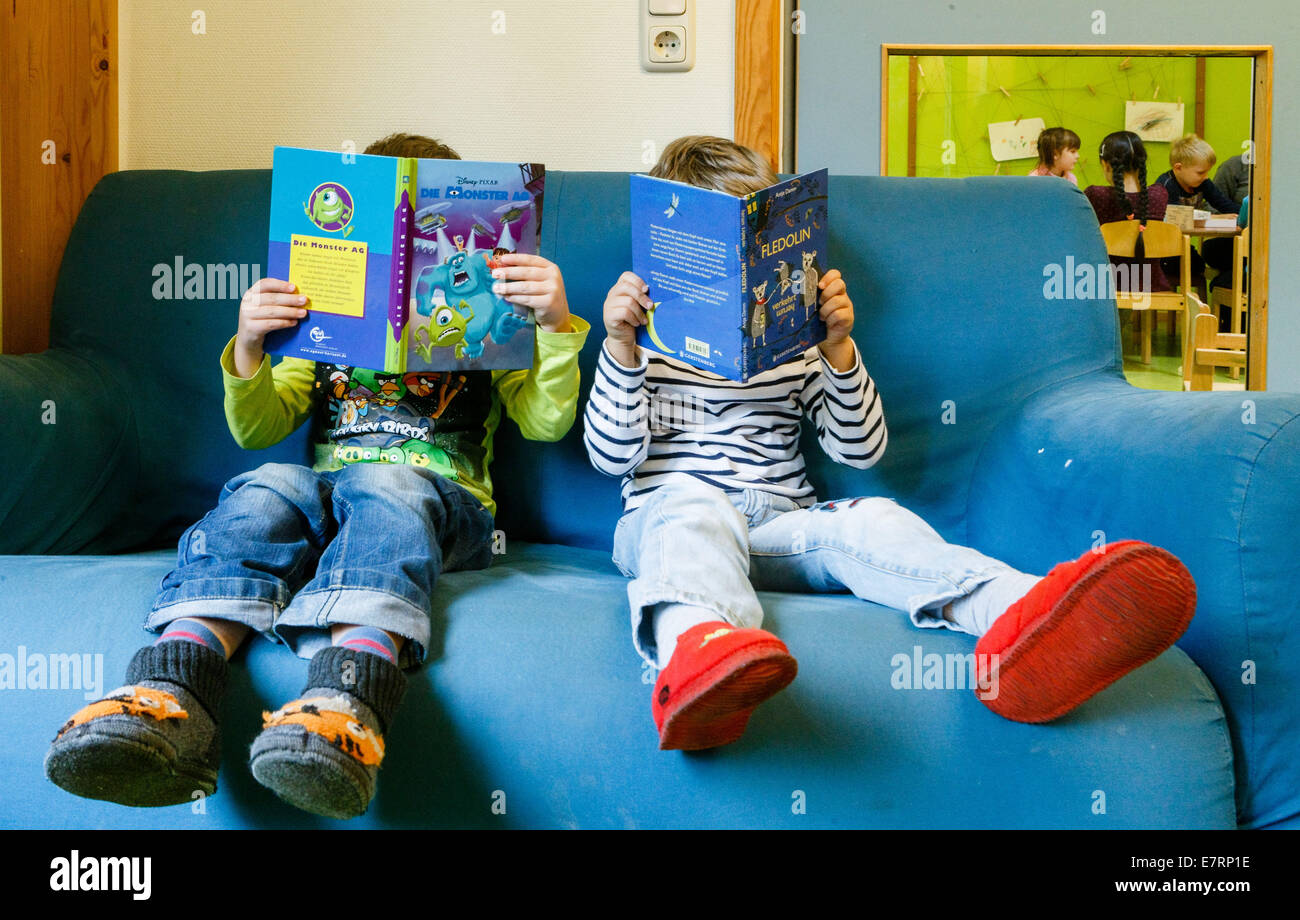 Two boys reading books Stock Photo - Alamy