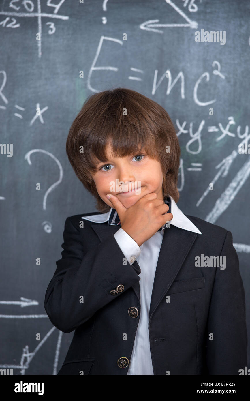 School boy trying to solve equations Stock Photo - Alamy