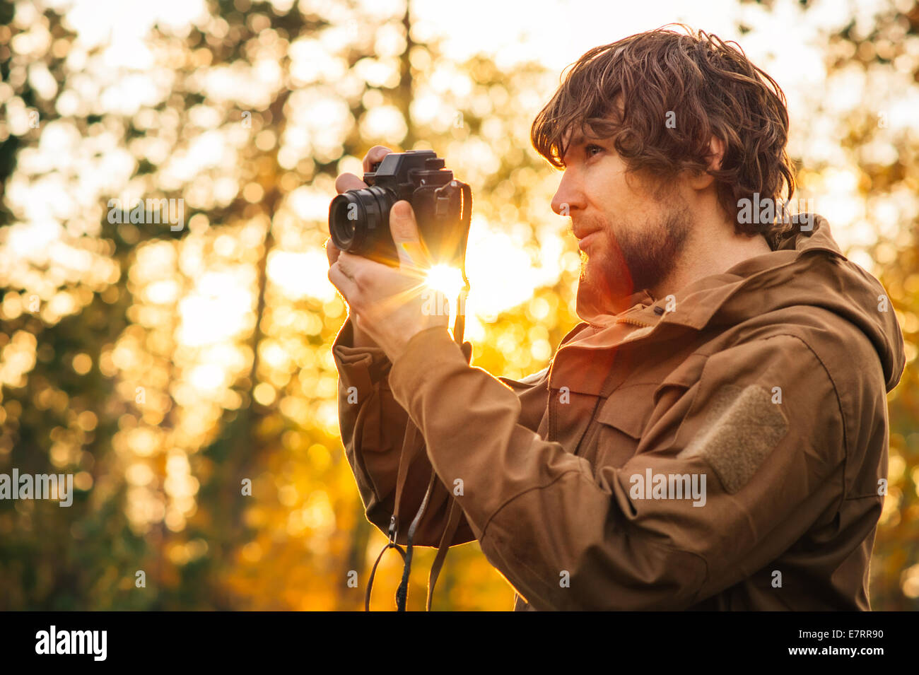 Young Man with retro photo camera outdoor Lifestyle concept sunlight ...