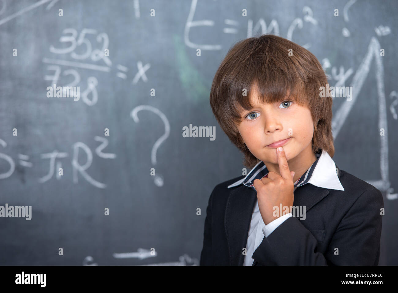 School boy trying to solve equations Stock Photo - Alamy