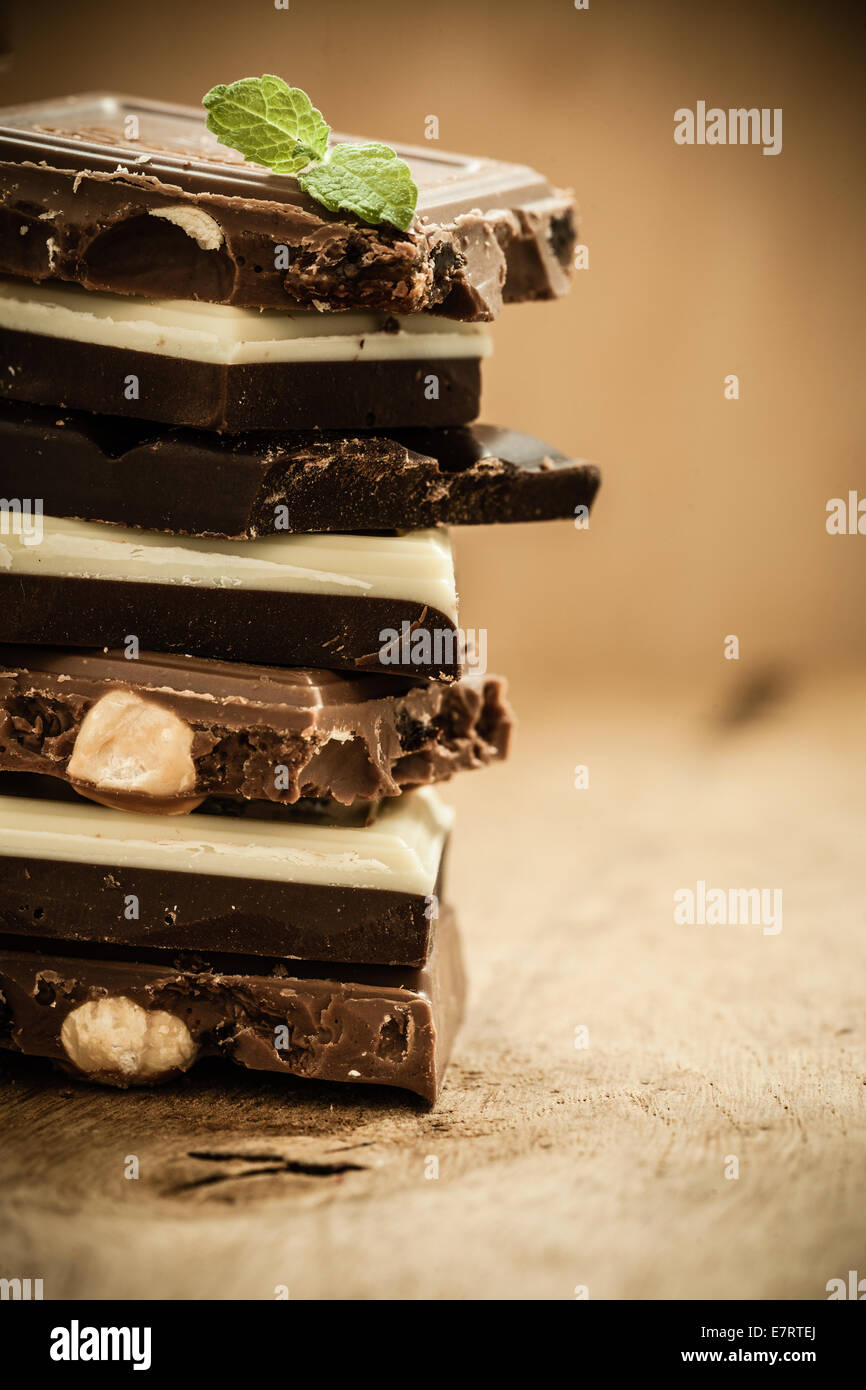 Closeup stack of different sorts chocolate pieces. Variety of ...