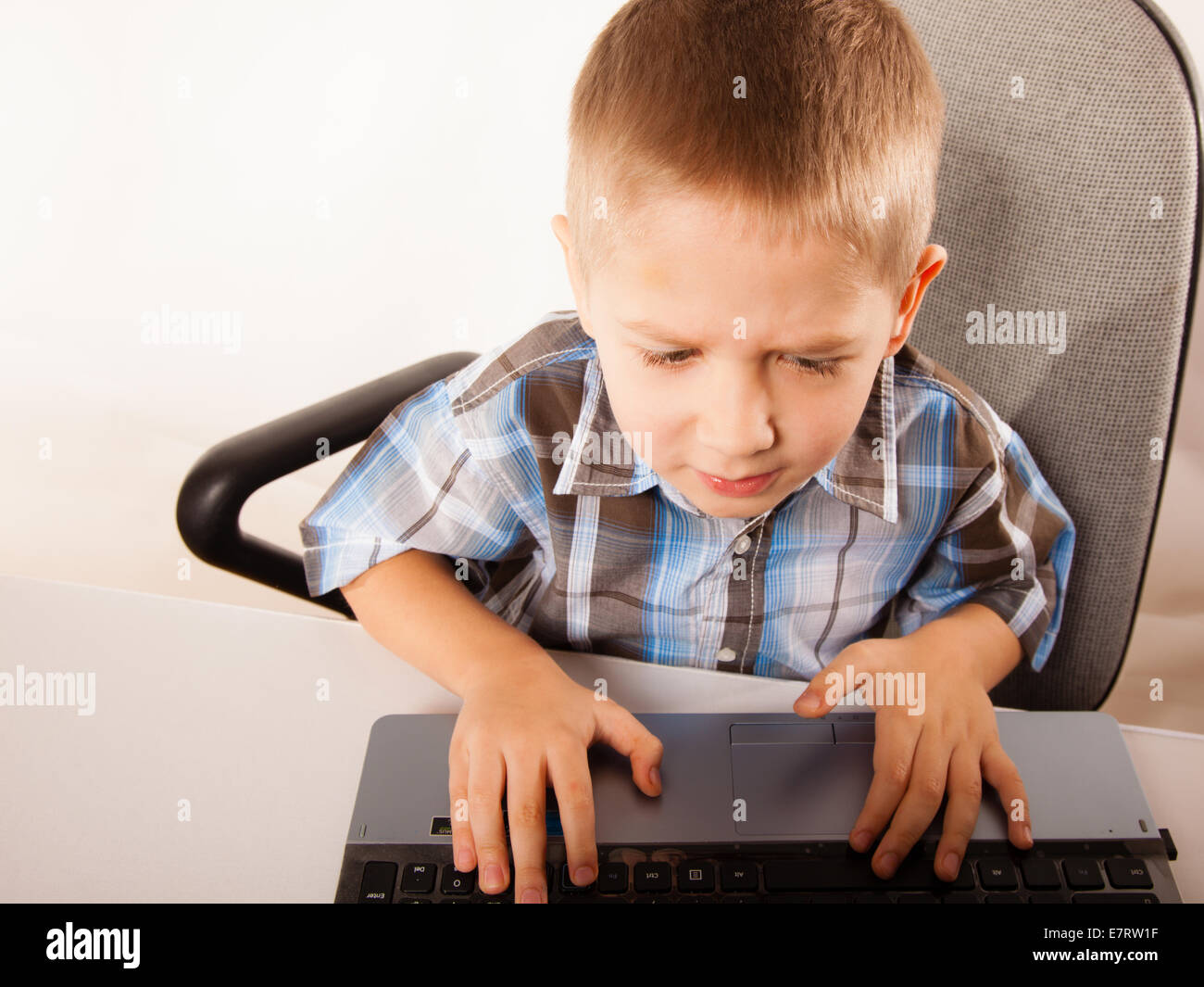 Education, school, technology and internet concept - little student boy ...