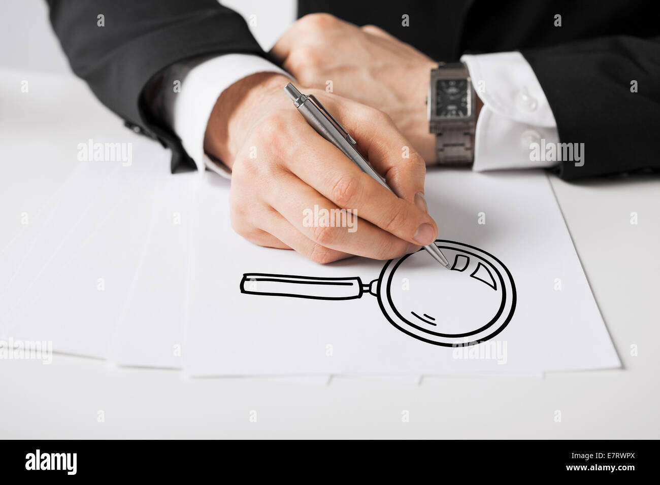 close up of male hands with pen drawing lens Stock Photo - Alamy