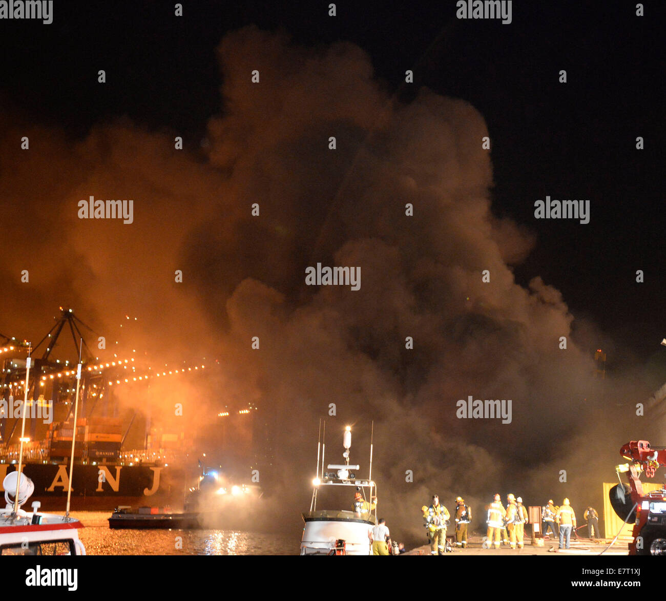 Wilmington CA. 23rd Sep, 2014. LA city firefighters battle a grater ...