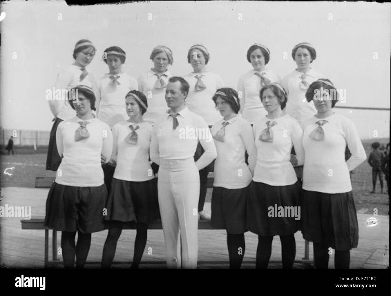 A group photograph from 1914 featuring twelve women in uniform, taken ...