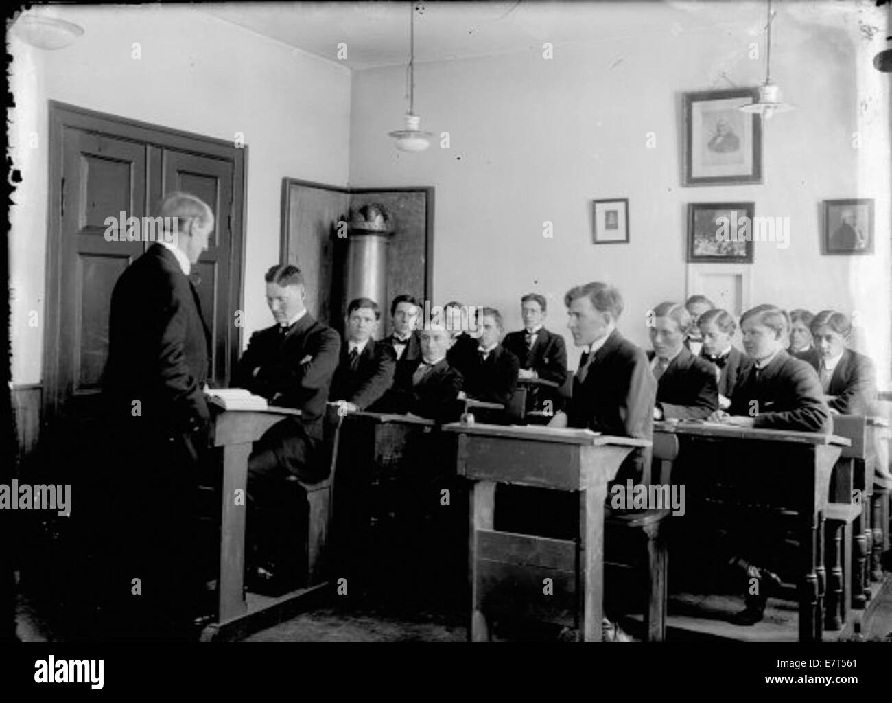 A photograph from 1918-1919 showing a teacher and students in a ...
