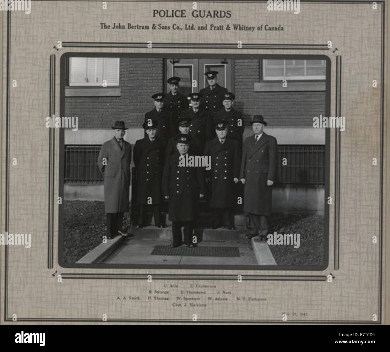 This photograph shows a group of police guards, captured in a ...