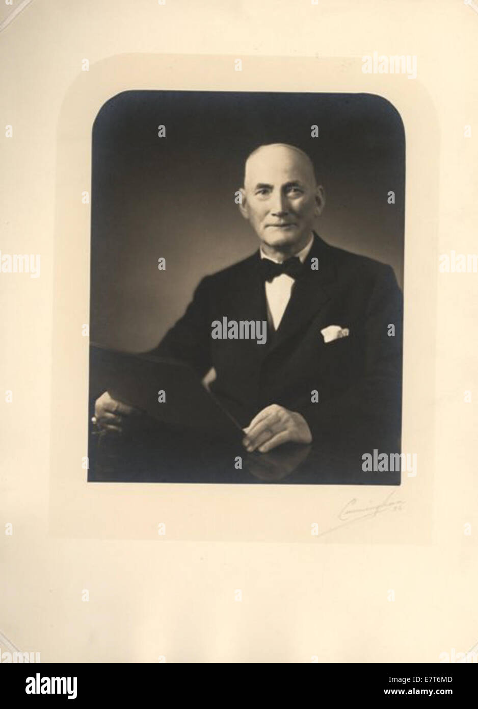 A classic portrait of an unnamed individual, captured in a formal pose ...