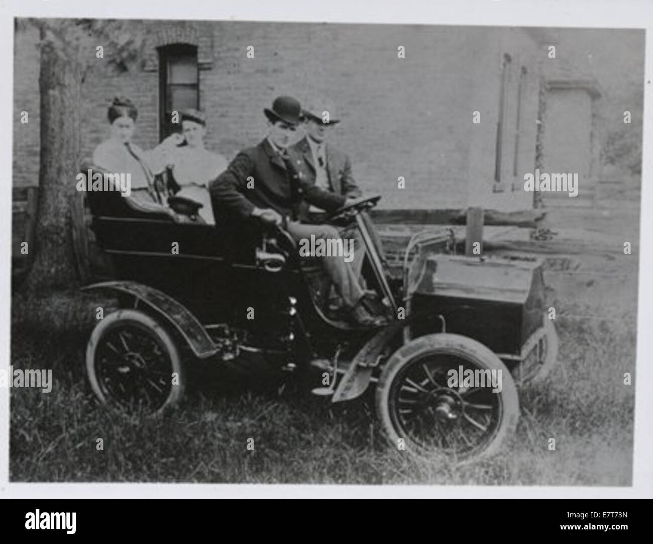 A photograph of early automobiles, capturing a moment in the history of ...