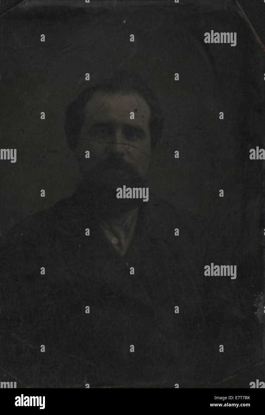 A portrait of an unknown man, captured in a formal setting. The ...