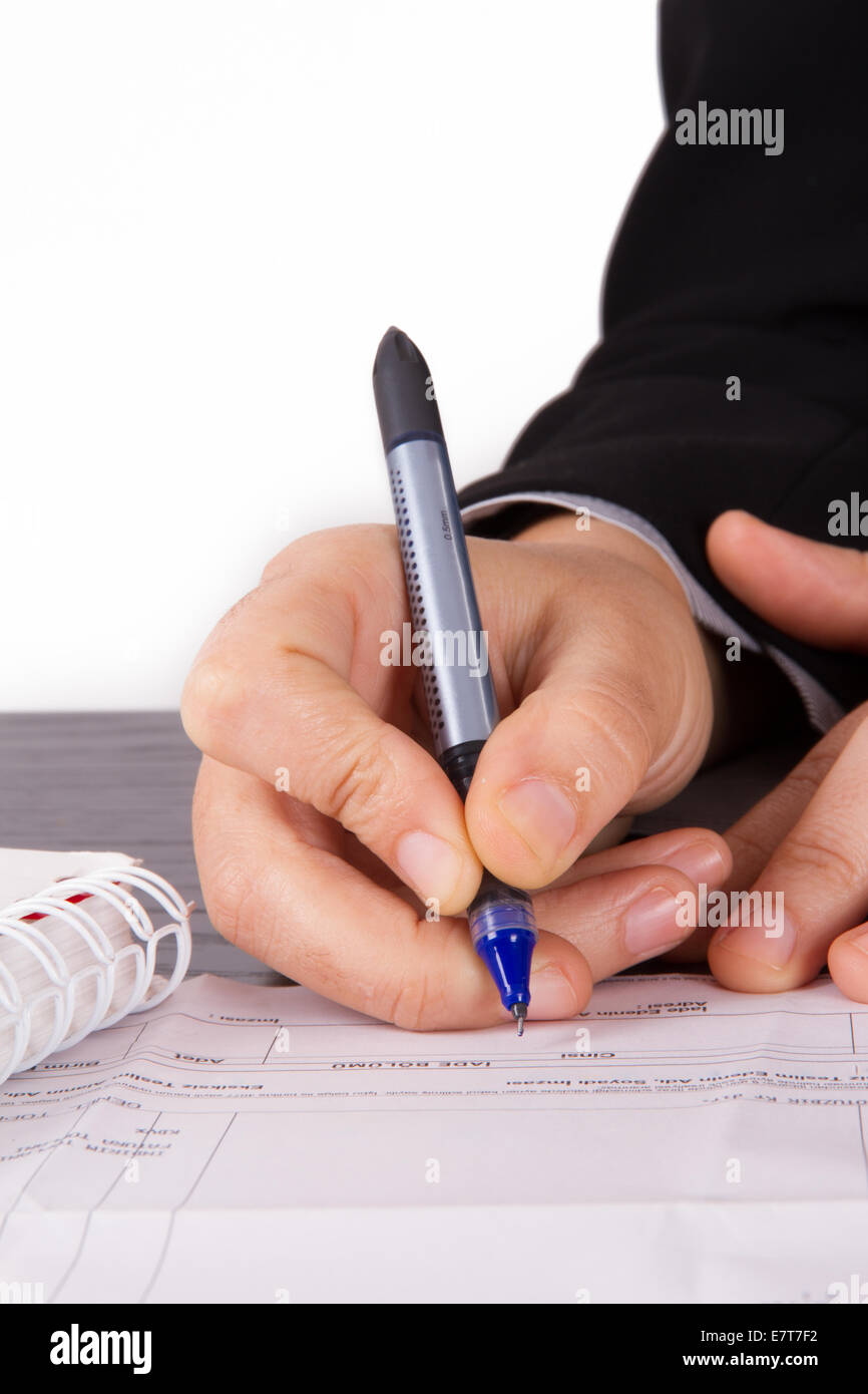Woman signing paper table hi-res stock photography and images - Alamy