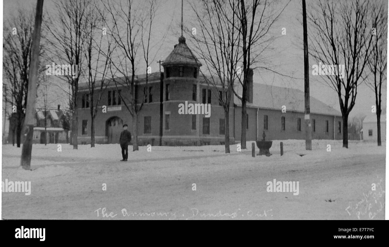 This photograph features an armoury, focusing on the storage of weapons ...