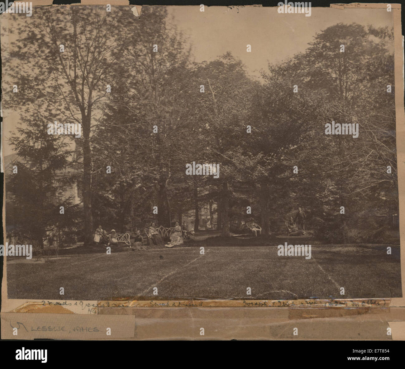 A photograph of the Joseph Lesslie family in their garden. The image ...