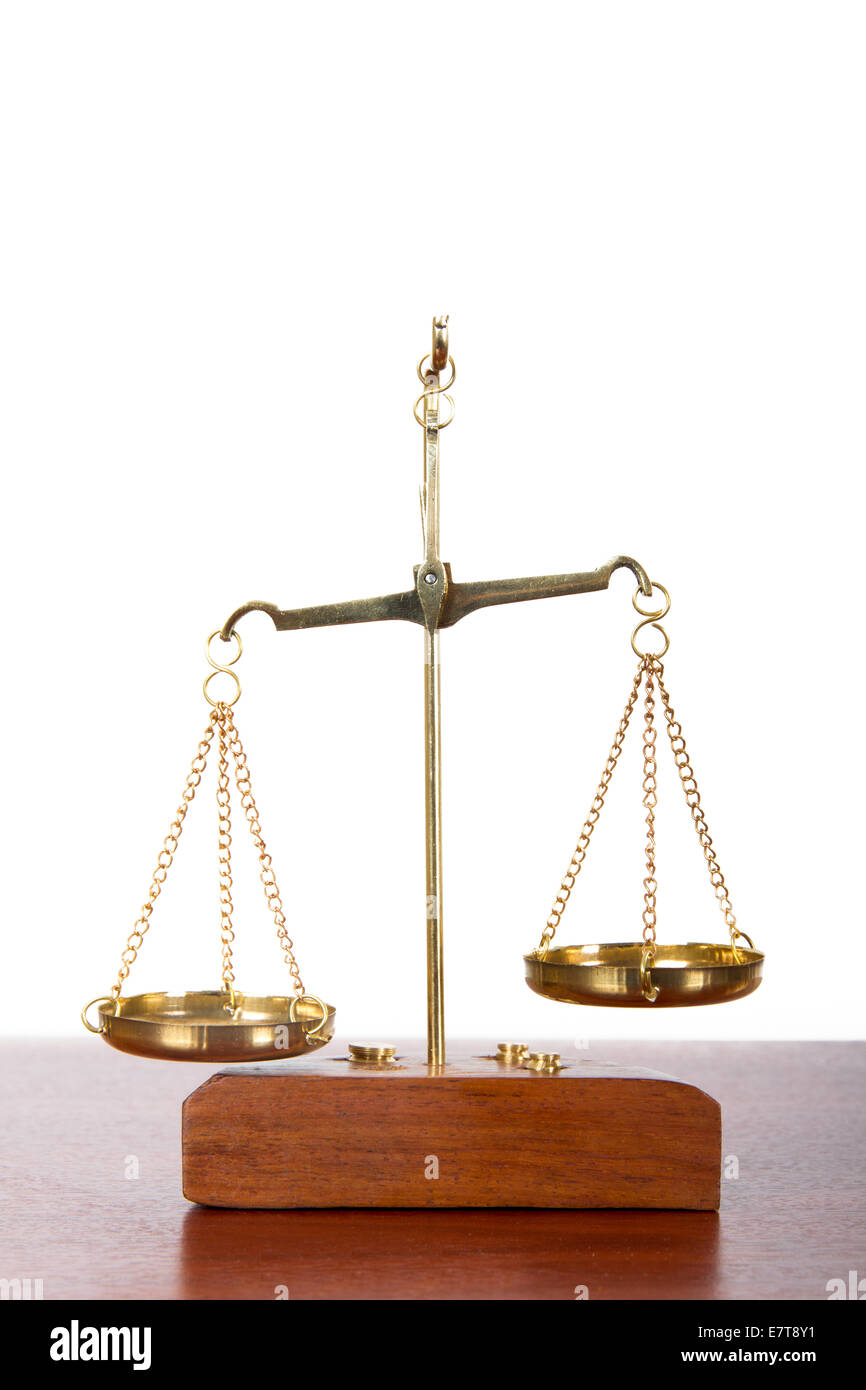 Golden scales of justice on wooden table, isolated on white background ...