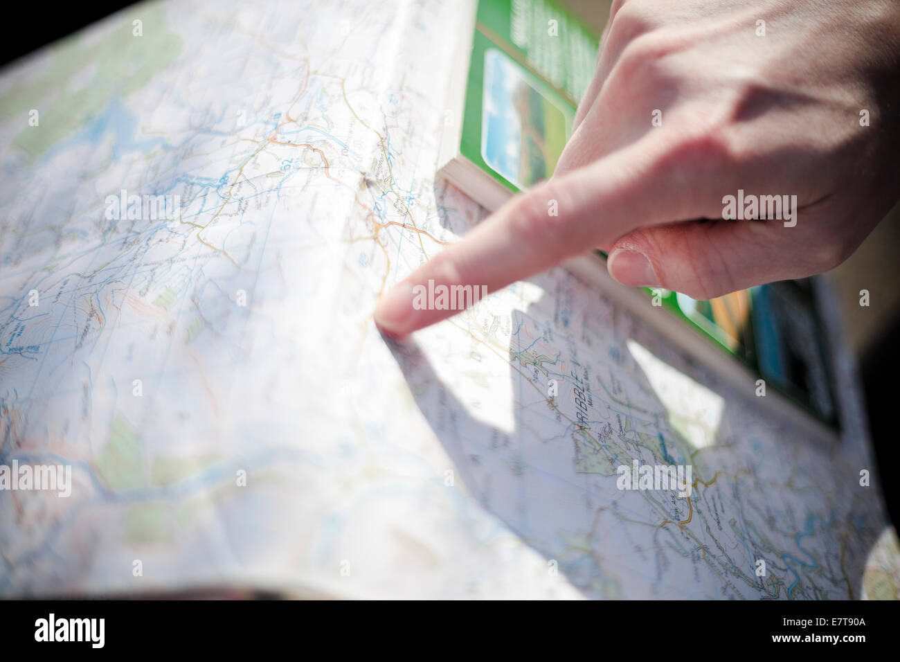 Map reading searching location in countryside Stock Photo - Alamy