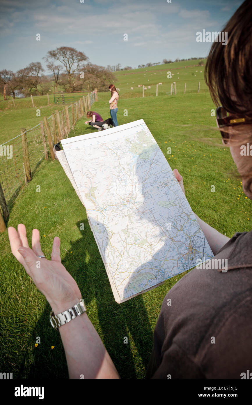 Map reading searching location in countryside Stock Photo - Alamy