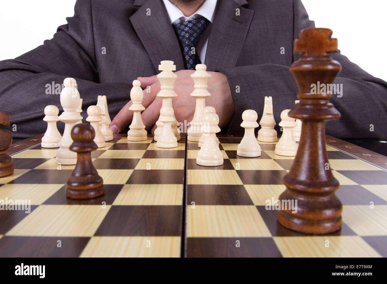 Businessman waiting opponent for playing chess on chess board and ...