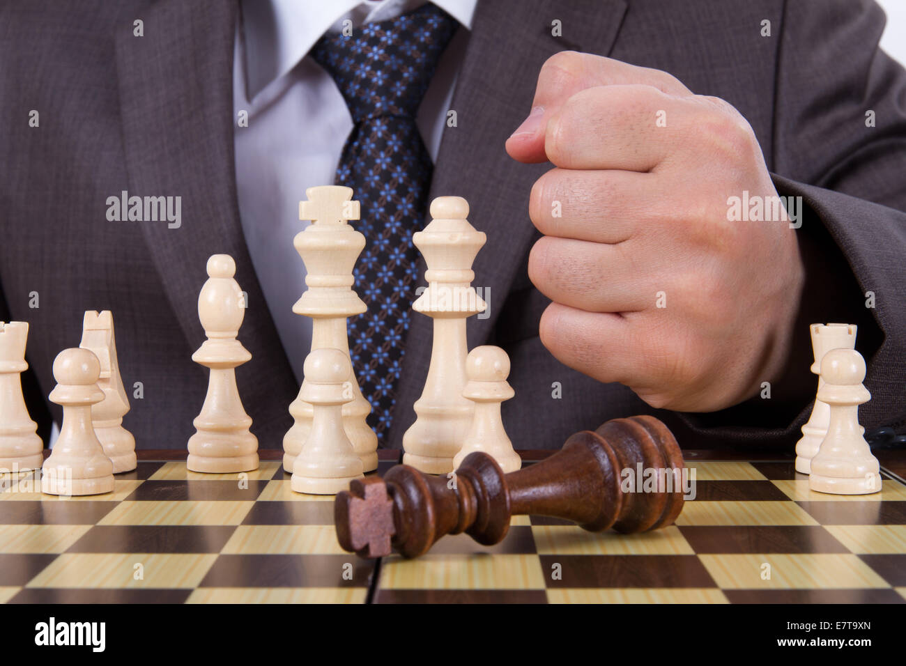Businessman win the chess game and gesture his hand as punch Stock ...