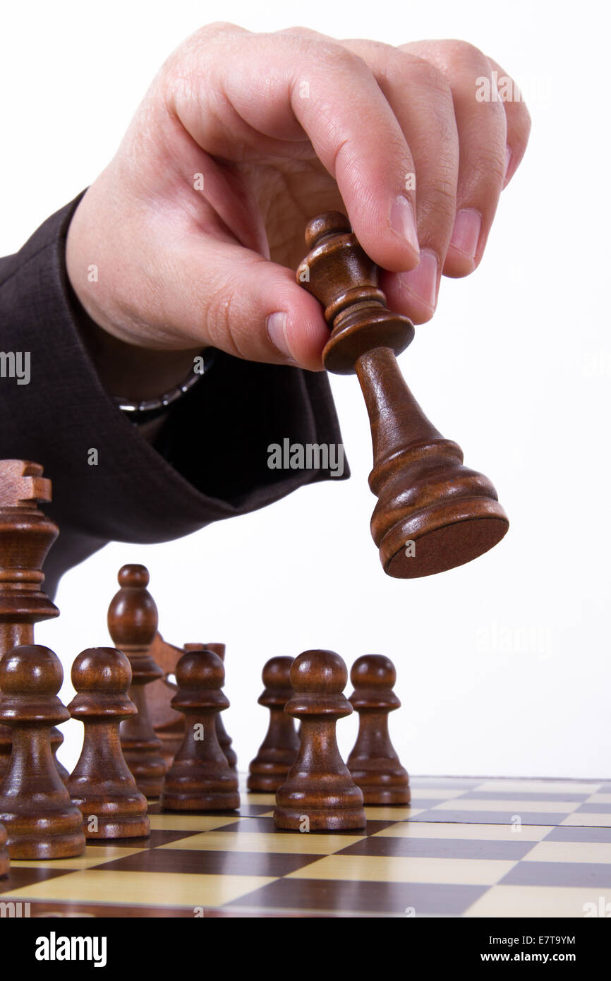 Strategy concept, businessman hand moving queen on chess board ...