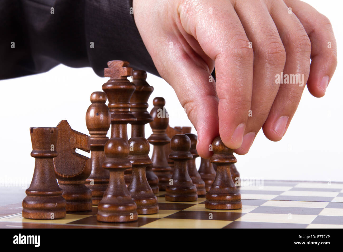 Hand moving chess piece on board hi-res stock photography and images ...