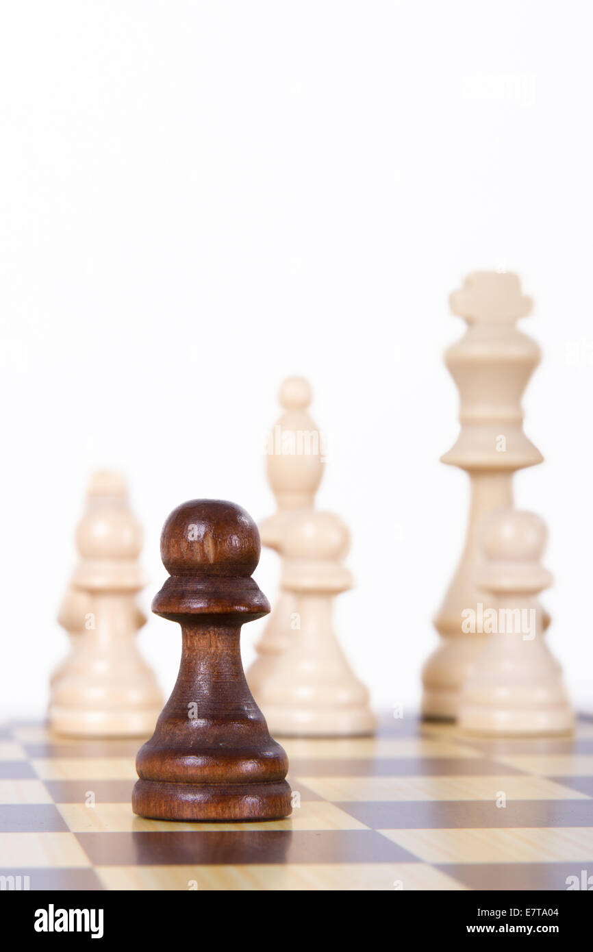 Pawn against opponent chess pieces on board, isolated on white ...