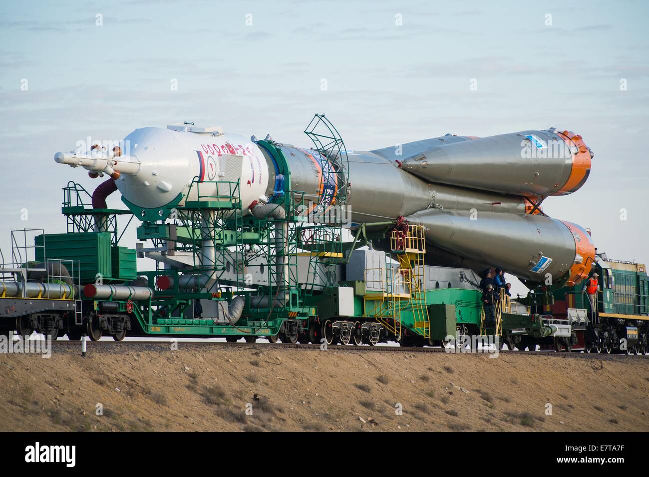 The Soyuz TMA-14M spacecraft rolls out to the launch pad by train at ...